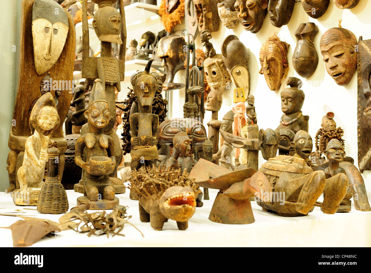 Traditional African handicraft. Wood statues in a market Stock Photo ...
