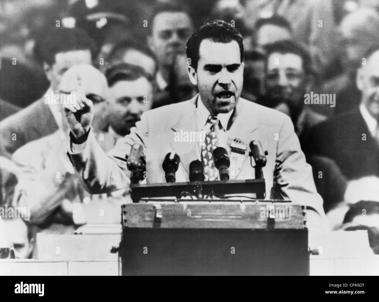 Senator Richard Nixon standing behind microphones accepting the ...
