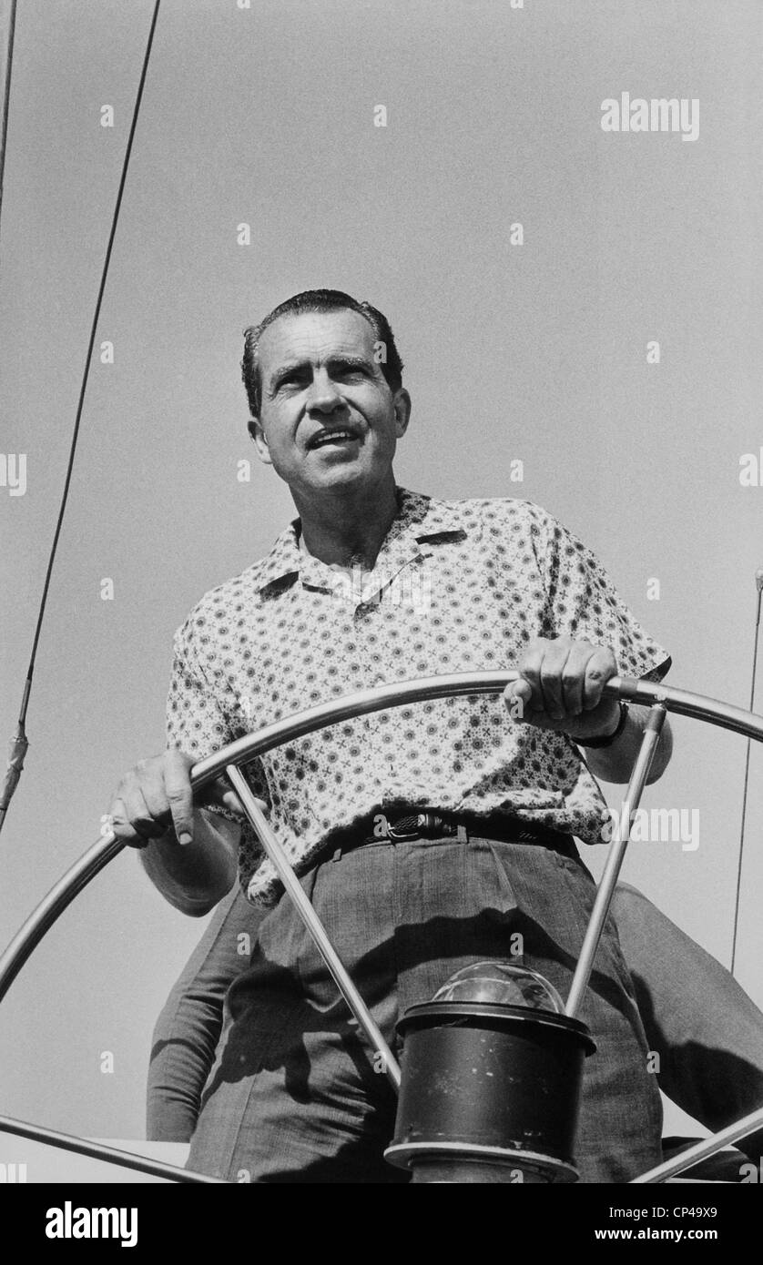 President Richard Nixon behind the wheel on of a boat. Ca. 1969-74 ...