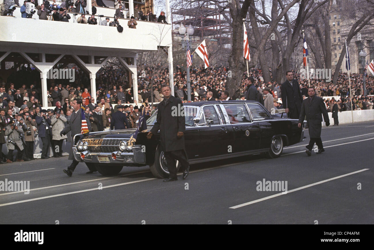 1965 Inauguration Parade. Lyndon and Lady Bird Johnson wave to crowds ...