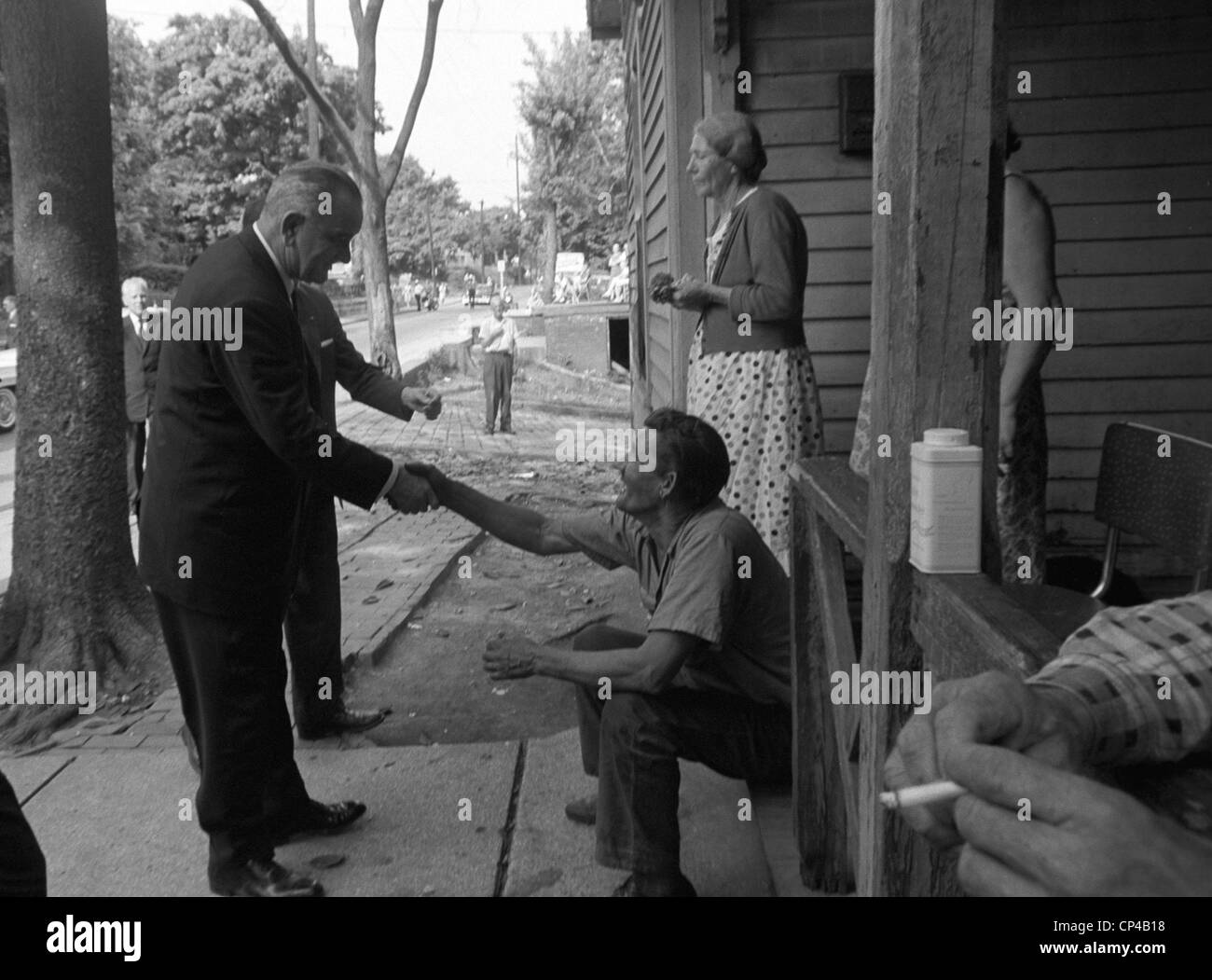 LBJ's War on Poverty. President Lyndon Johnson shakes hands with an ...