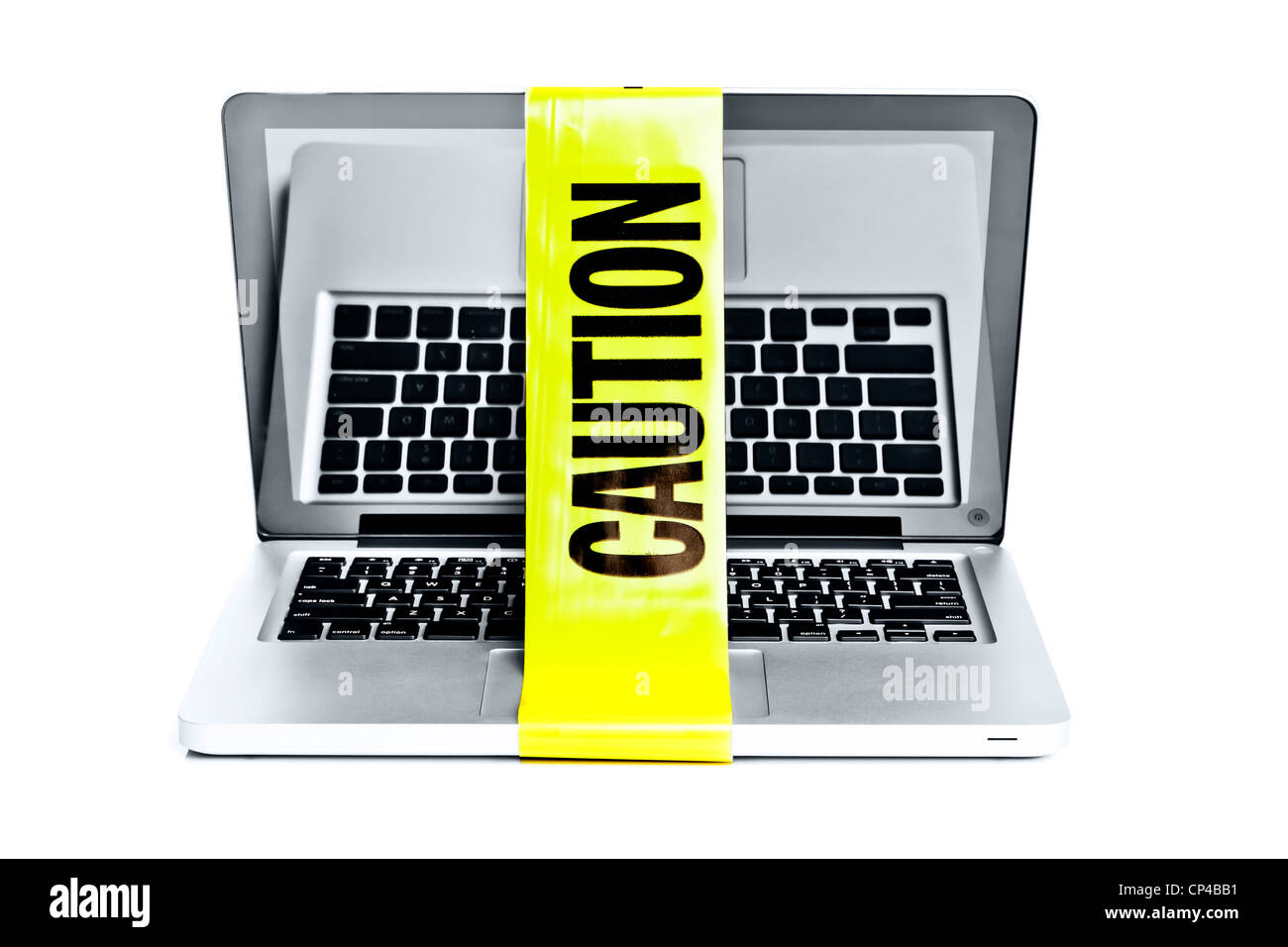 Laptop computer with caution tape wrapped around it Stock Photo - Alamy