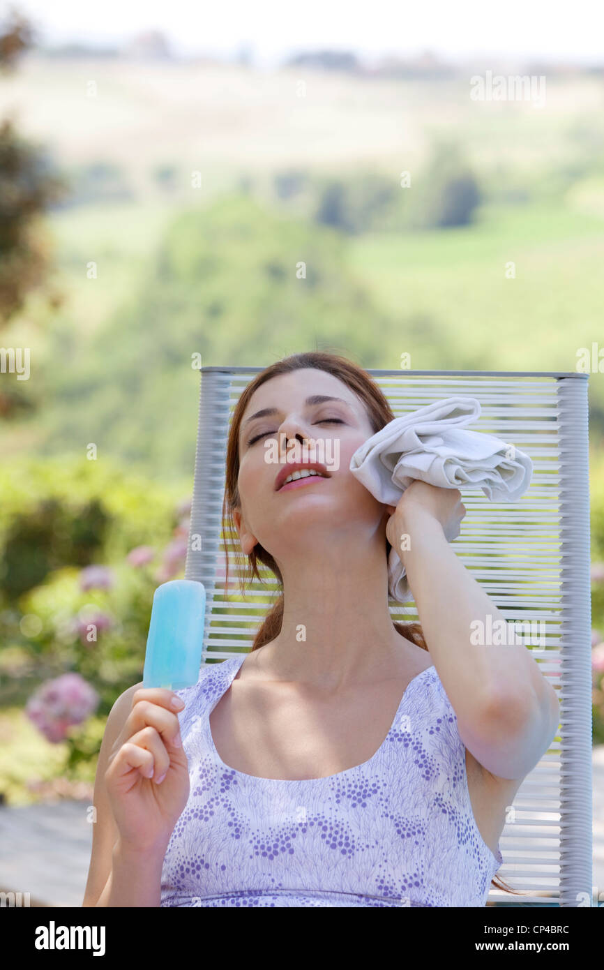 woman eating a popsicle Stock Photo - Alamy