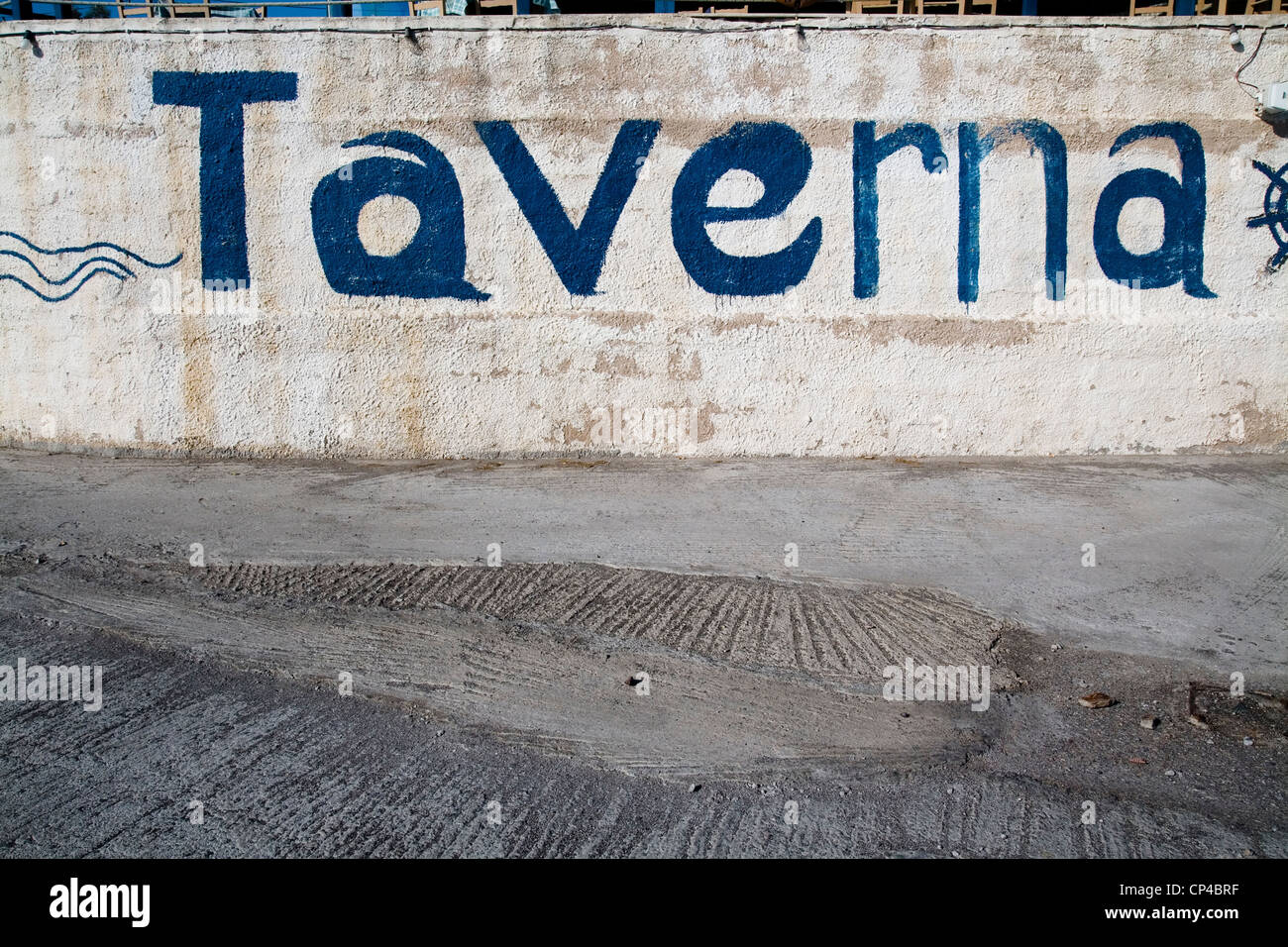 Greek taverna sign painted on wall Stock Photo - Alamy