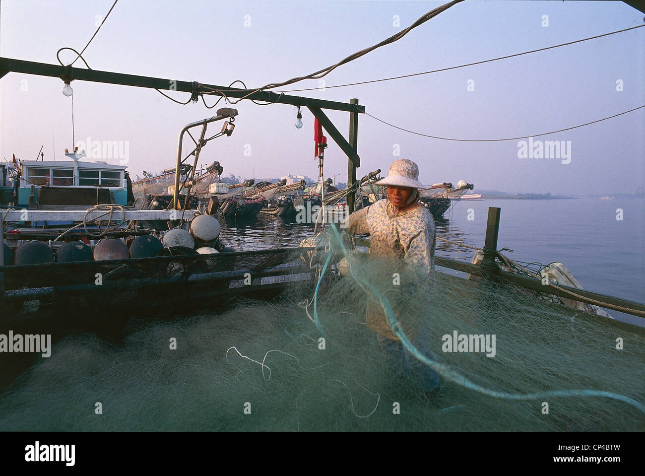 Taiwan - Tainan. Port of Anping, retired fisherman nets on the vessel ...