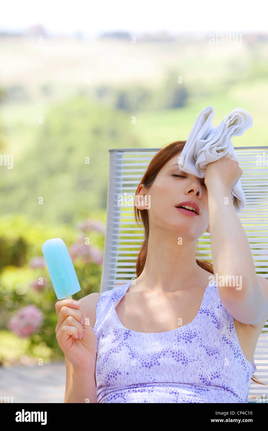 woman eating a popsicle Stock Photo - Alamy