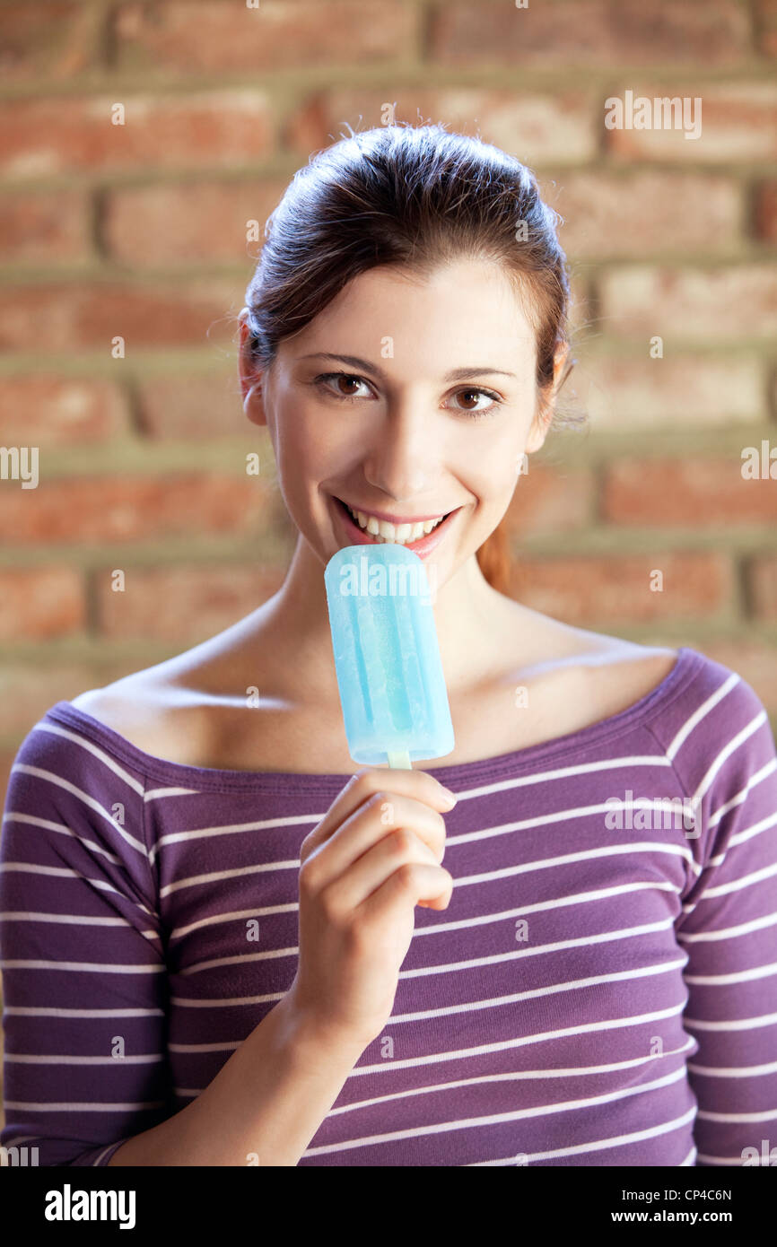 woman eating a popsicle Stock Photo - Alamy
