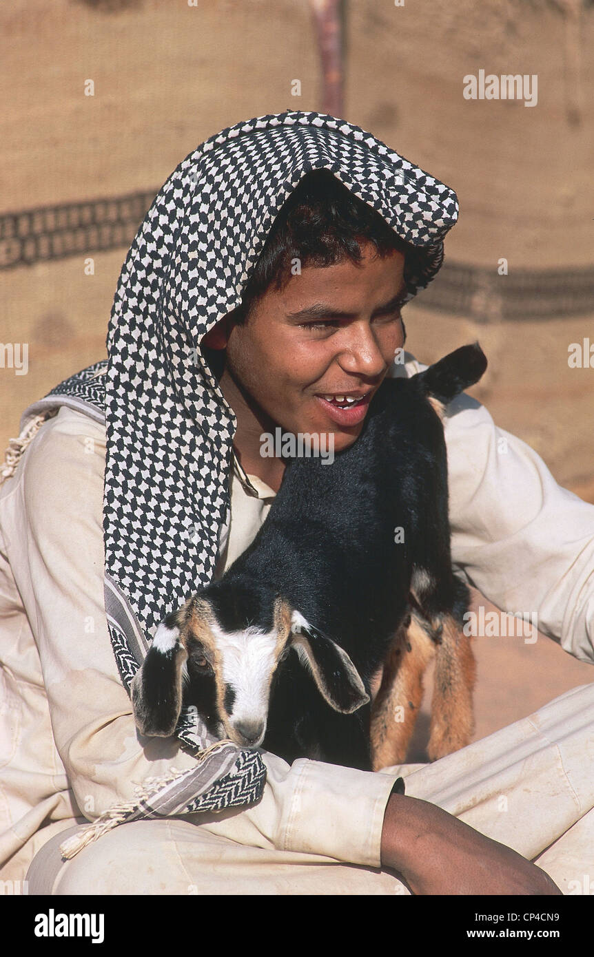 Egypt - Sinai Peninsula - Bedouin boy with a kid Stock Photo - Alamy