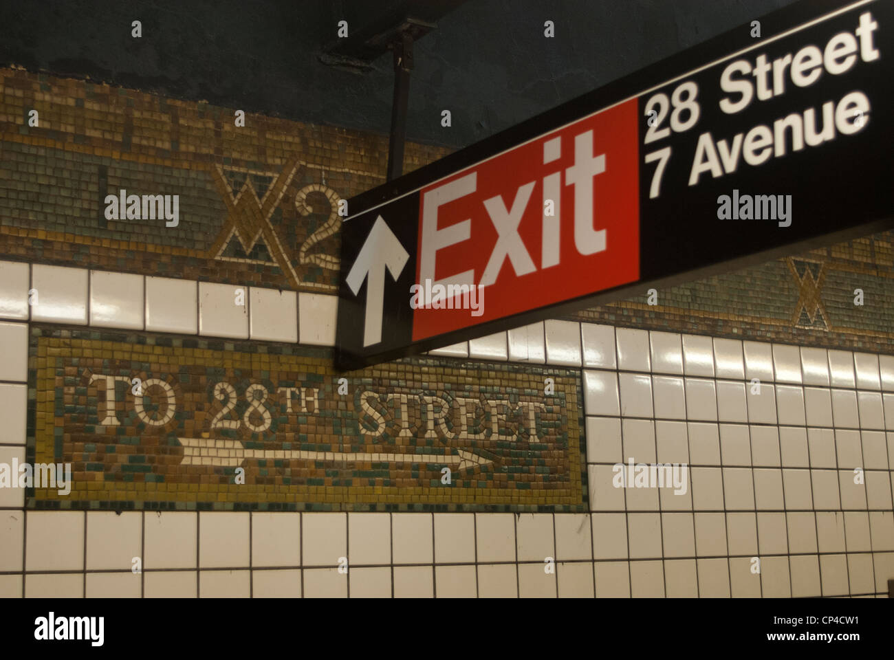 New and old signage in the West 23rd Street subway station on the IRT ...