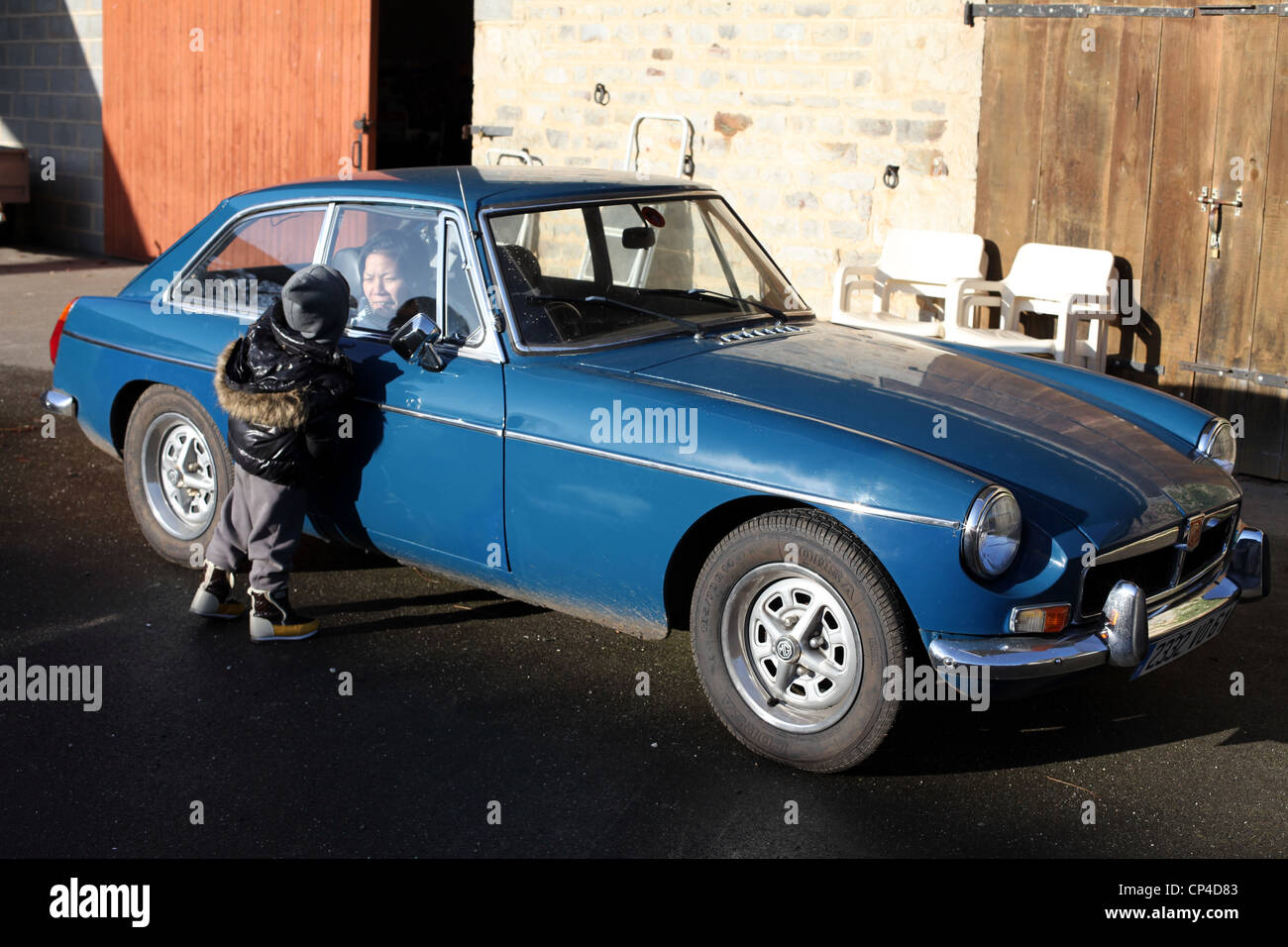 It's a photo of an old MG Collection car park in a court of a farm in ...