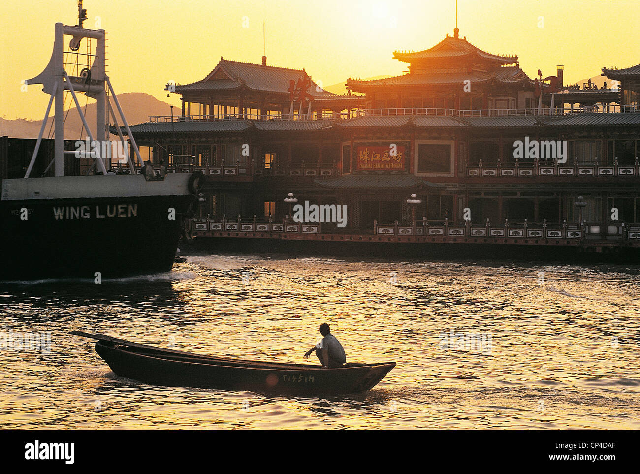 Province of Macao - Macao (Macau). Boat at sea at sunset Stock Photo ...
