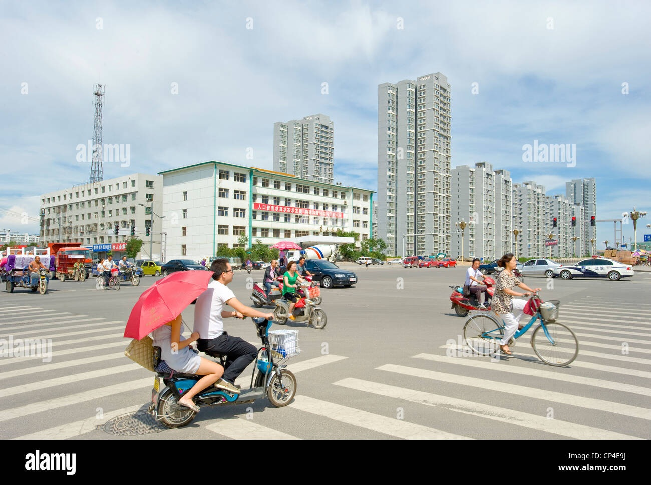 A busy junction along one of the main roads in Datong with modern ...