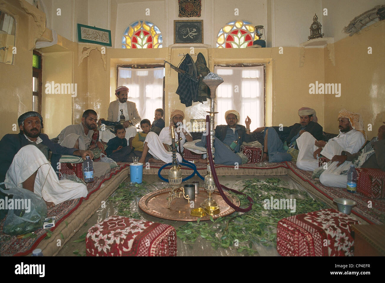 Yemen - Sanaa Province - Sana'a. Men gathered to chew qat and smoking ...