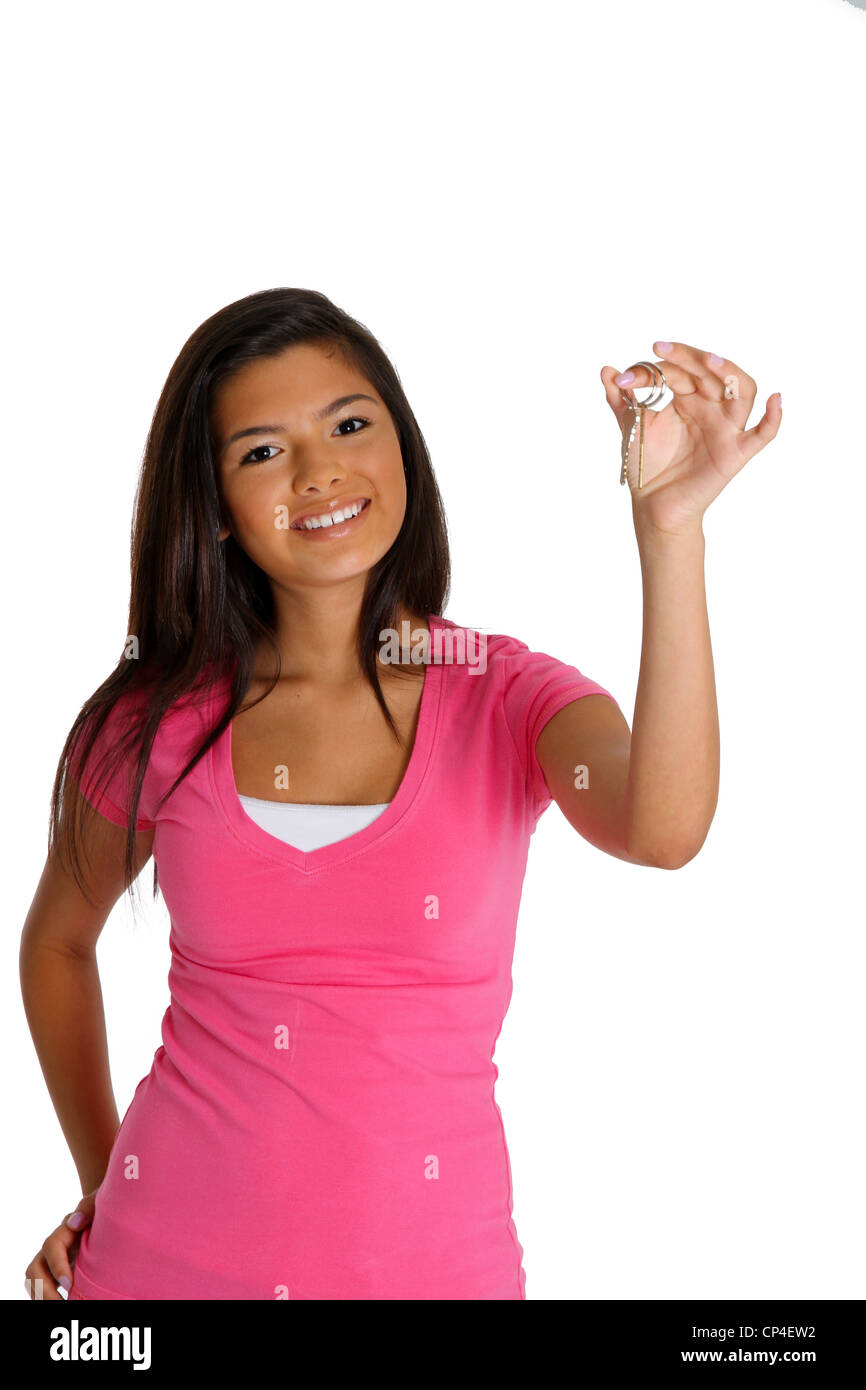 Teenage girl set against a white background holding keys Stock Photo ...
