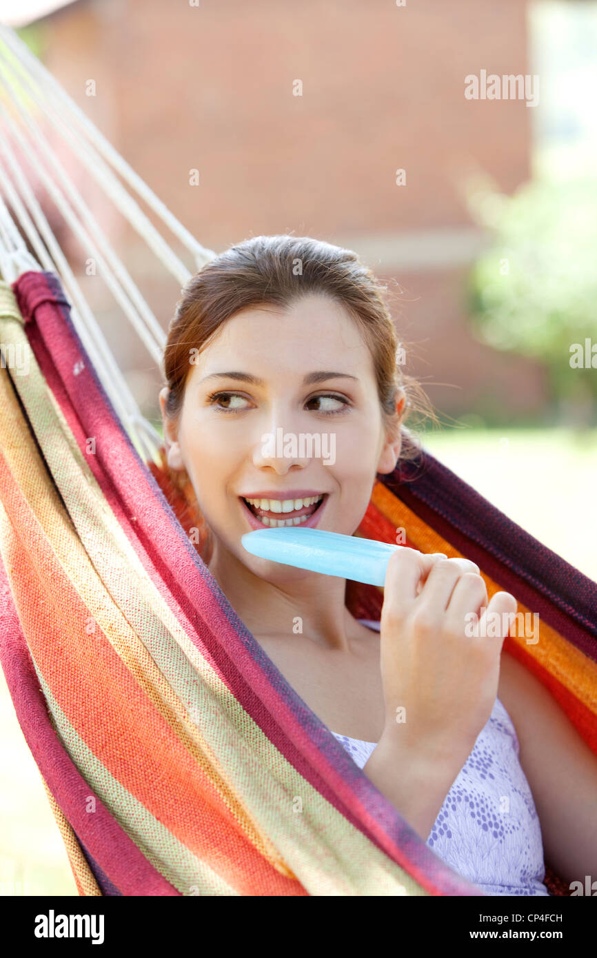 woman eating a popsicle Stock Photo - Alamy