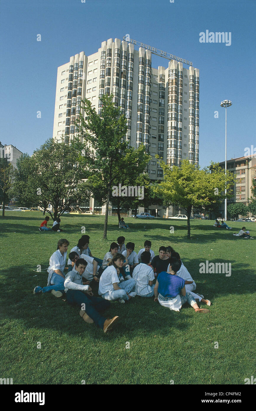 Spain - Navarra - Pamplona. Teenagers on a lawn in the gardens of Plaza ...