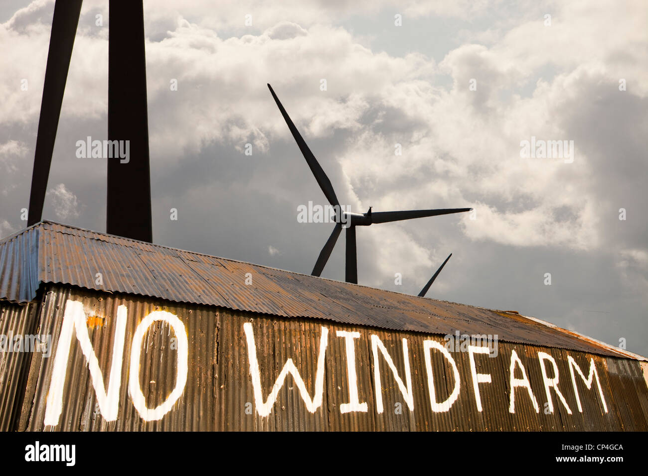 A protest sign in front of a wind farm Stock Photo - Alamy