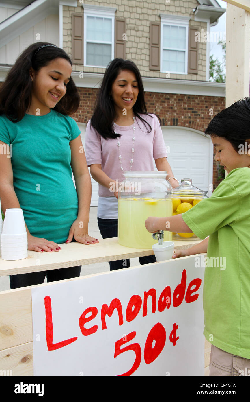 Children selling lemonade in front of their home Stock Photo - Alamy