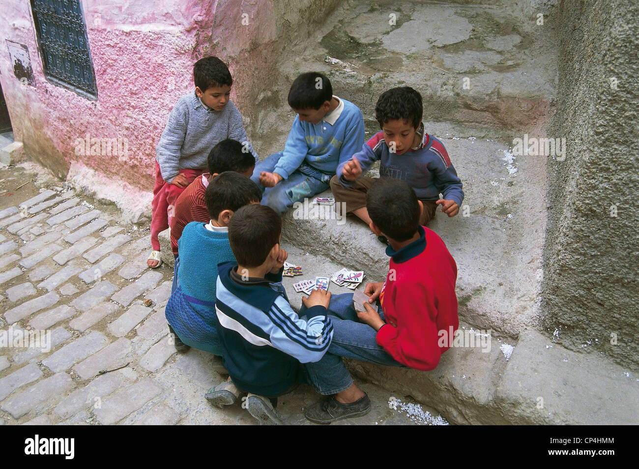 Morocco - Moulay Idriss - Children playing cards Stock Photo - Alamy