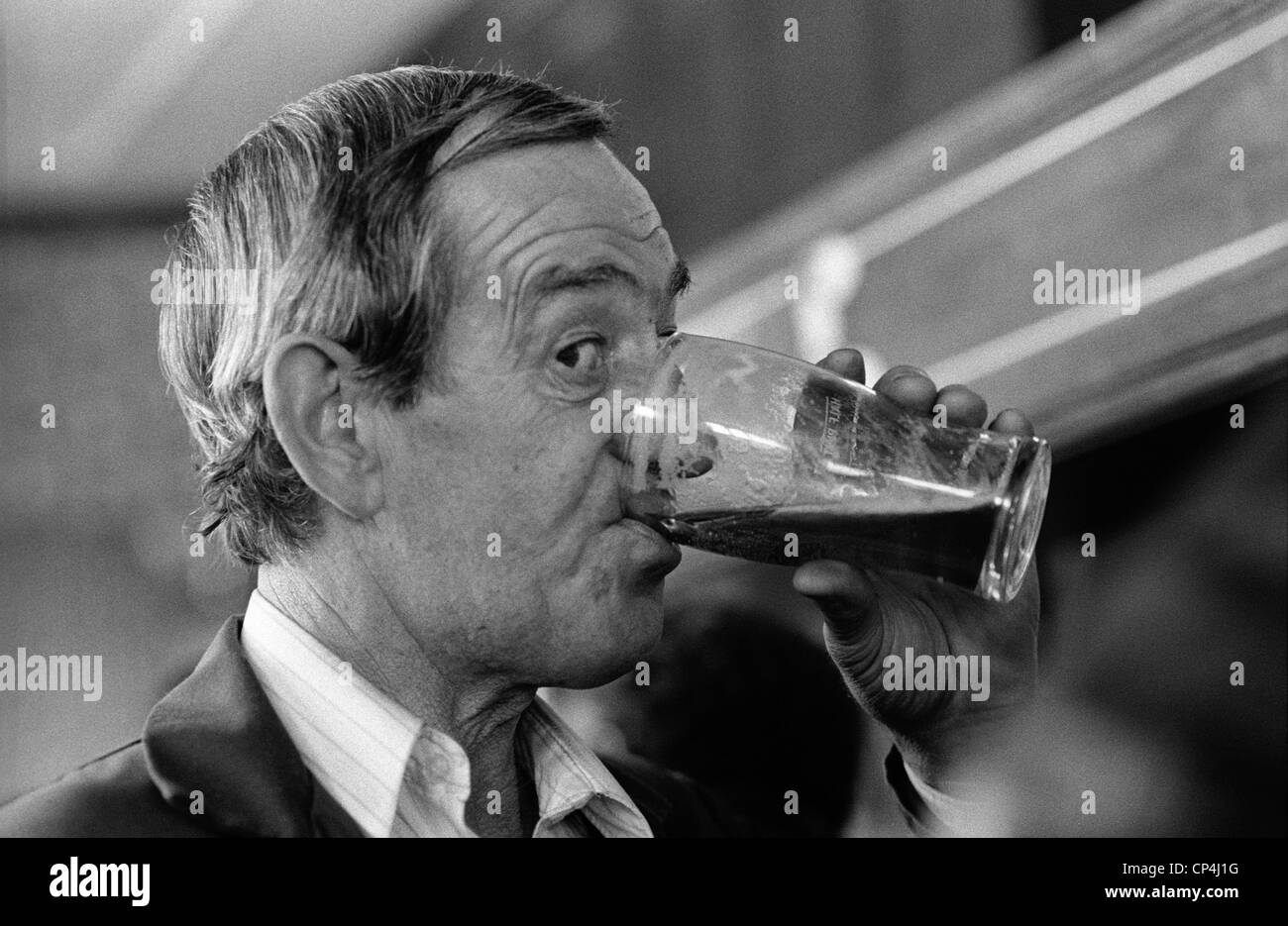 A man drinks a pint in a London pub Stock Photo - Alamy