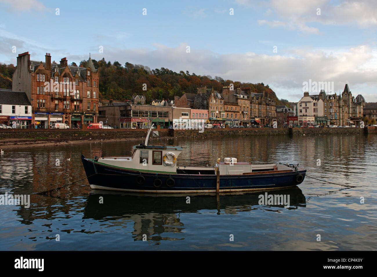 United Kingdom - Scotland - Oban. A fishing boat and, on the background ...