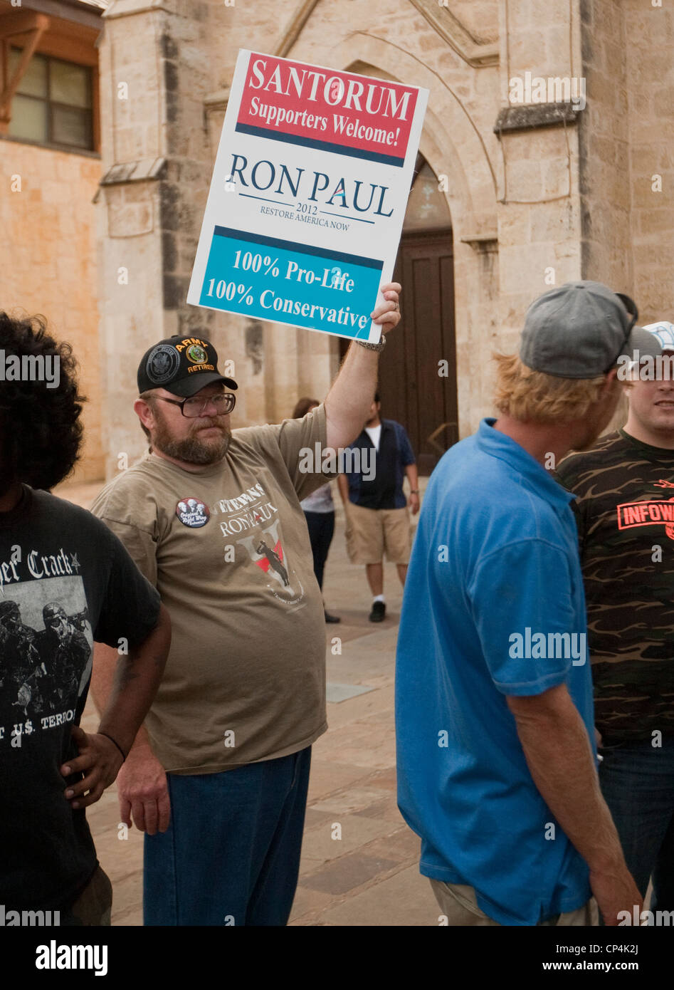Anglo male holds up sign pro-Ron Paul at campaign swing in San Antonio ...