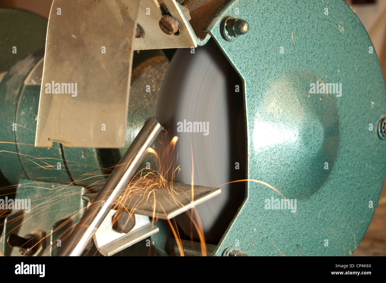 Sparks while grinding metal on a grinding wheel Stock Photo - Alamy
