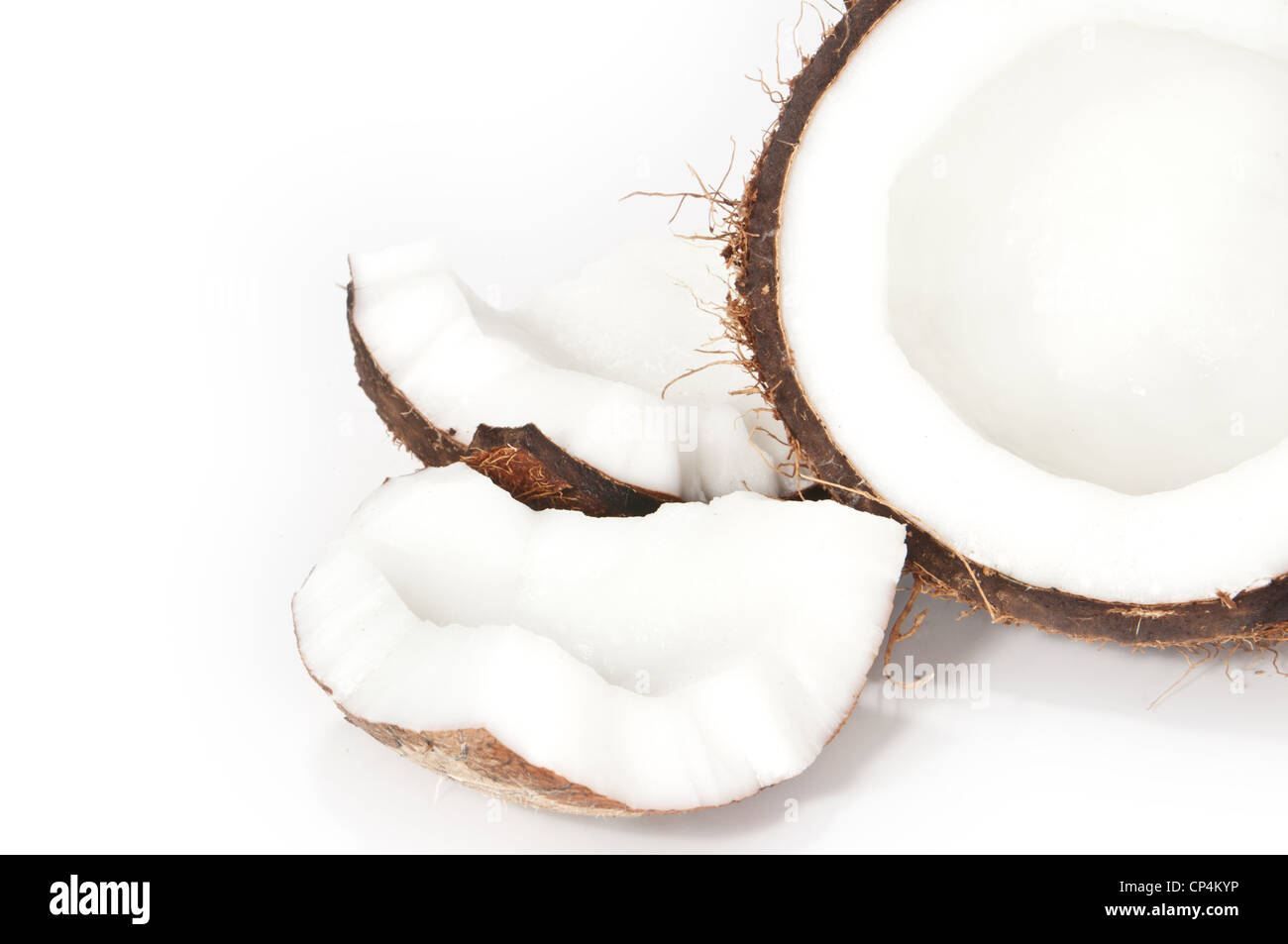 A cracked coconut on white background Stock Photo - Alamy