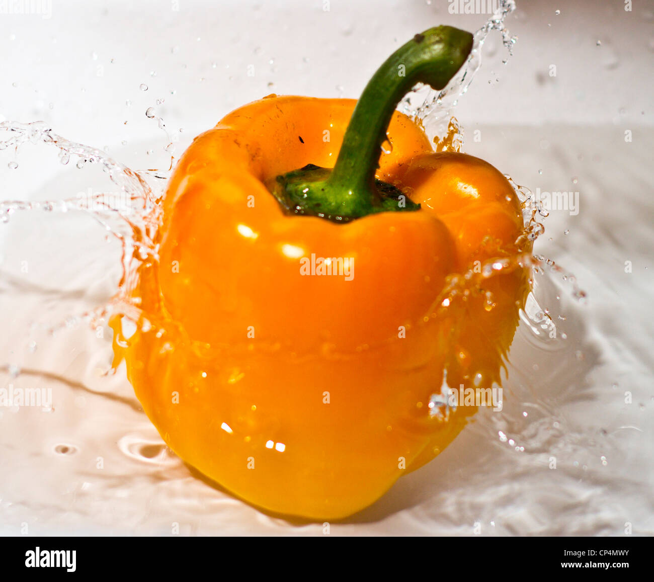 yellow peppr in water Stock Photo - Alamy