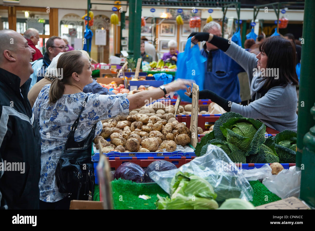 Ireland, North, Belfast, St Georges Market, Veg stall selling potatoes ...