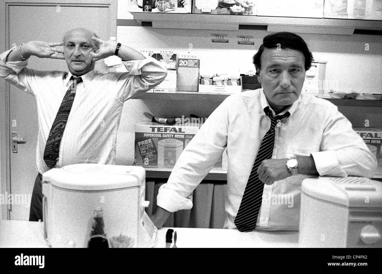 Sales men at the ideal home exhibition Stock Photo - Alamy