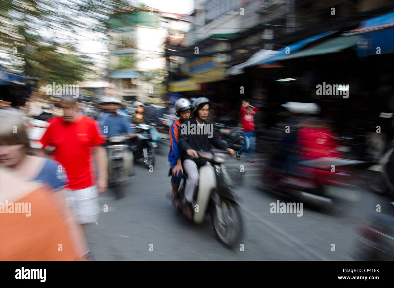 Hanoi intense traffic with motorcycles, cars and pedestrians Stock ...