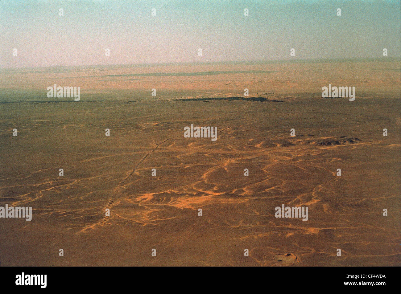 Algeria - Sahara Desert - A foggara that conveys the water at an oasis ...