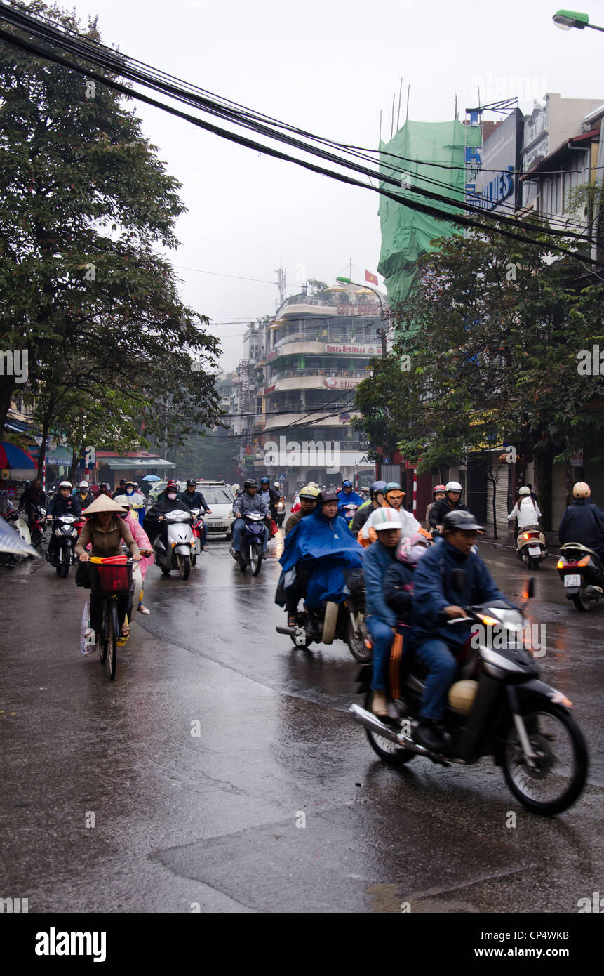 Hanoi intense traffic with motorcycles, cars and pedestrians Stock ...