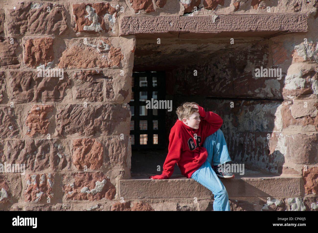 young boy sitting window Stock Photo - Alamy