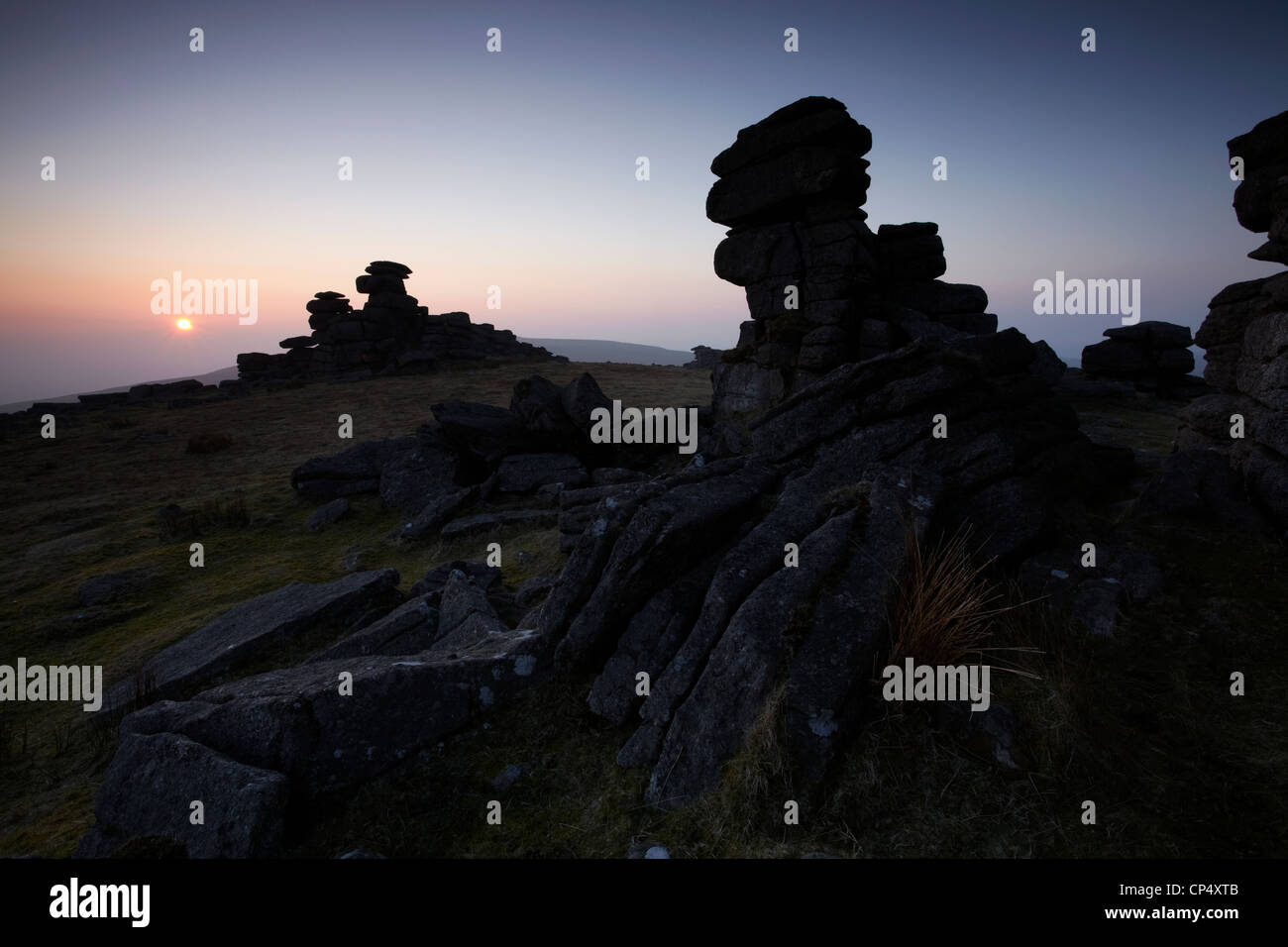 Sunset at the granite rocky outcrop at Great Staple Tor on Dartmoor ...