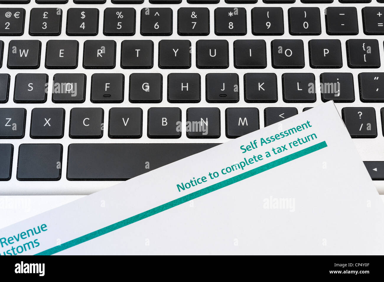 Detail of blank tax return form on top of computer keyboard Stock Photo ...
