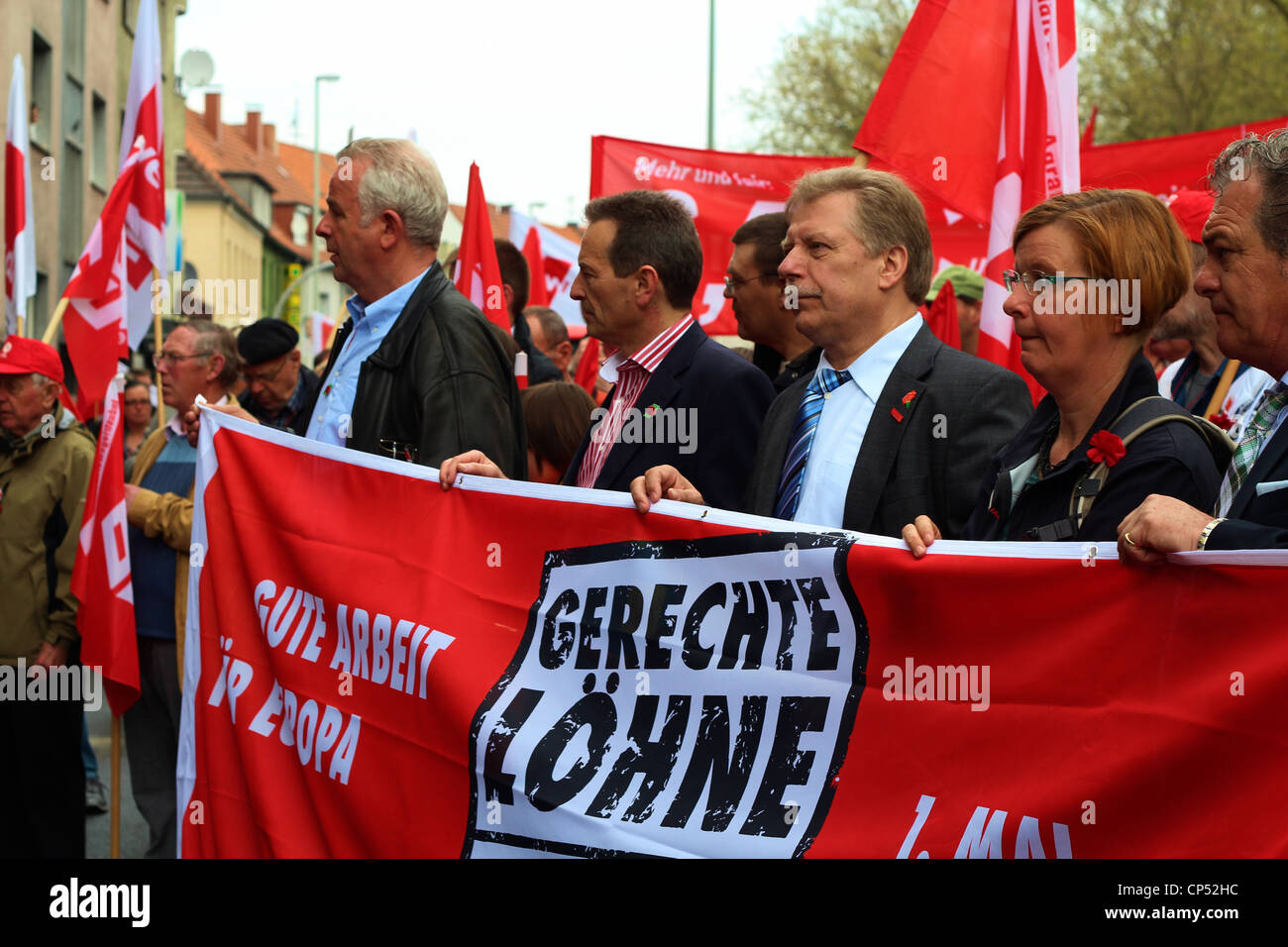 Crowd of Demonstrators holding Banner for fair wage and social securety ...