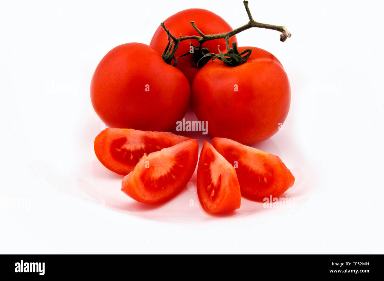 Organic tomato whole and cuted isolated Stock Photo - Alamy