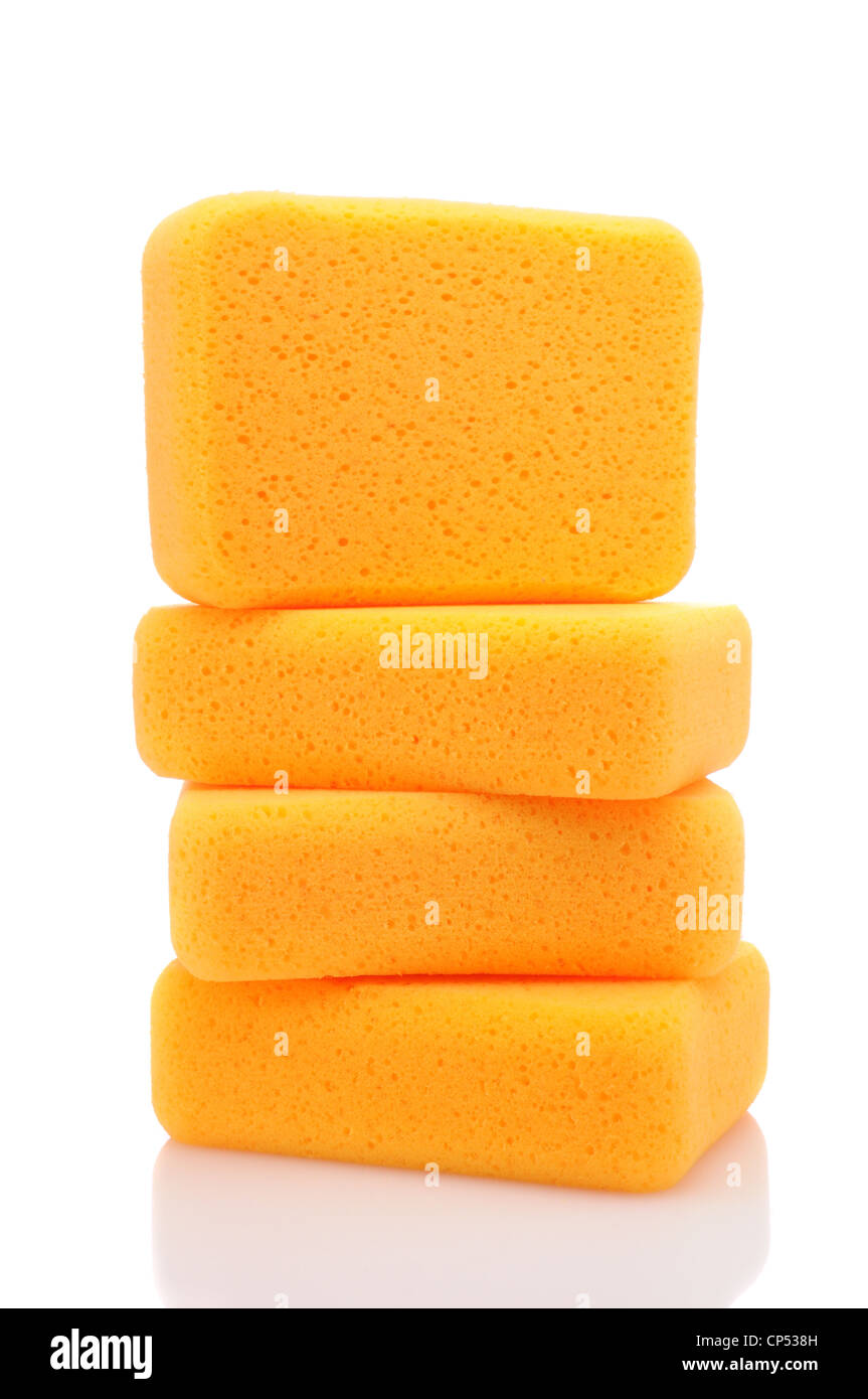 A stack of sponges over a white background with reflection Stock Photo ...