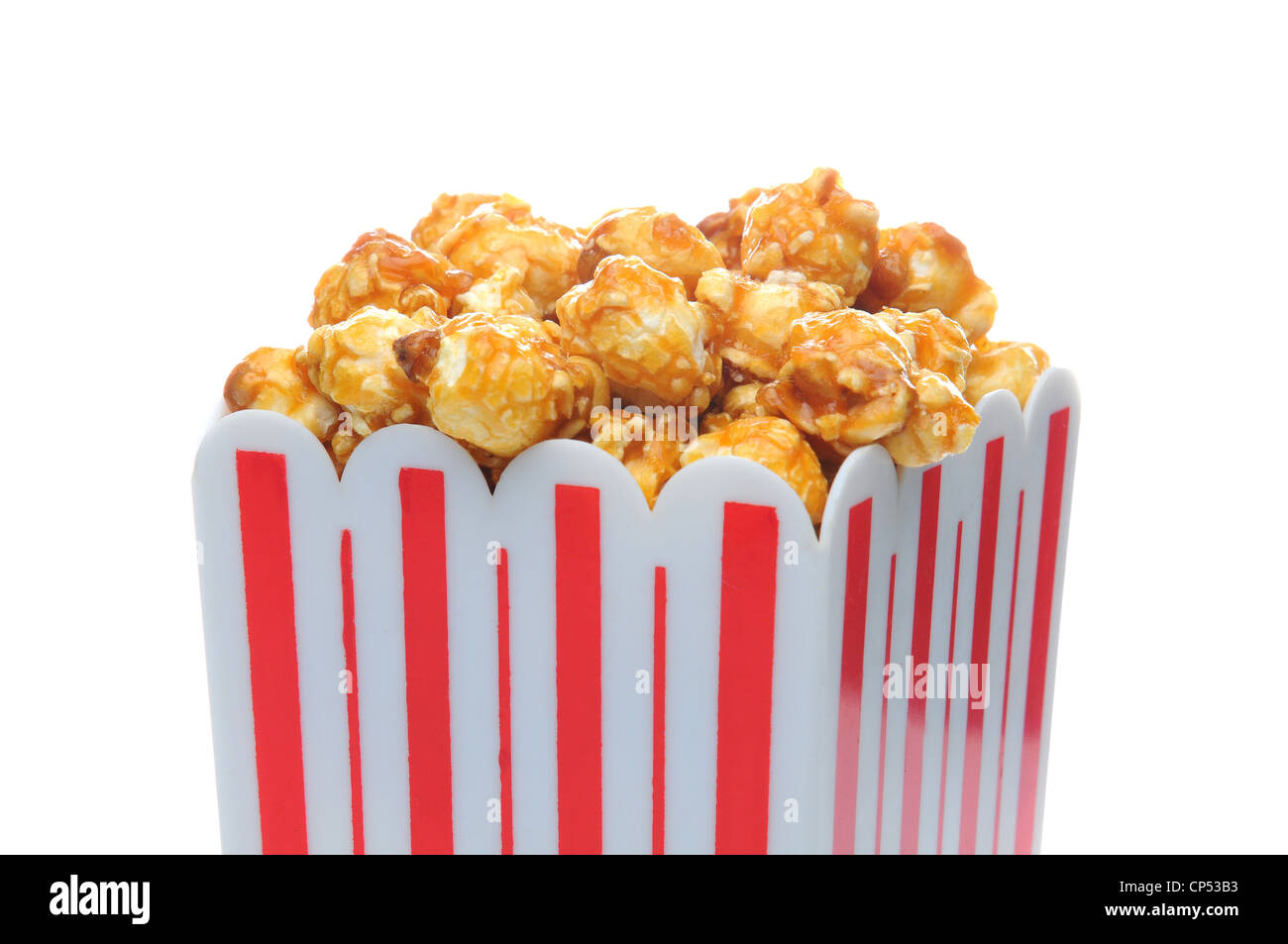 Closeup of caramel corn in a striped container over white Stock Photo ...
