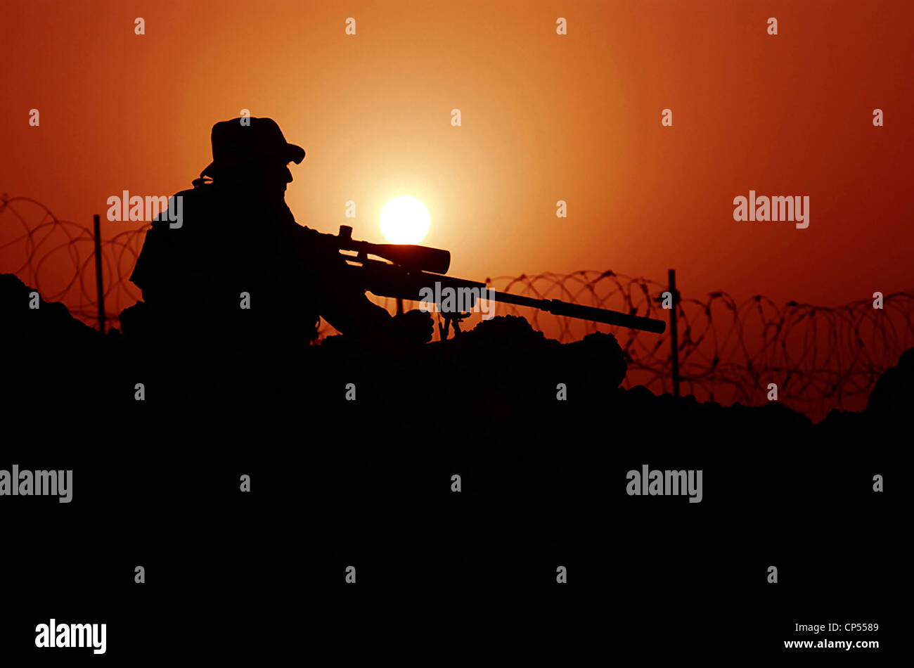 A US Special Forces soldier looks through his MK 12 sniper rifle at ...