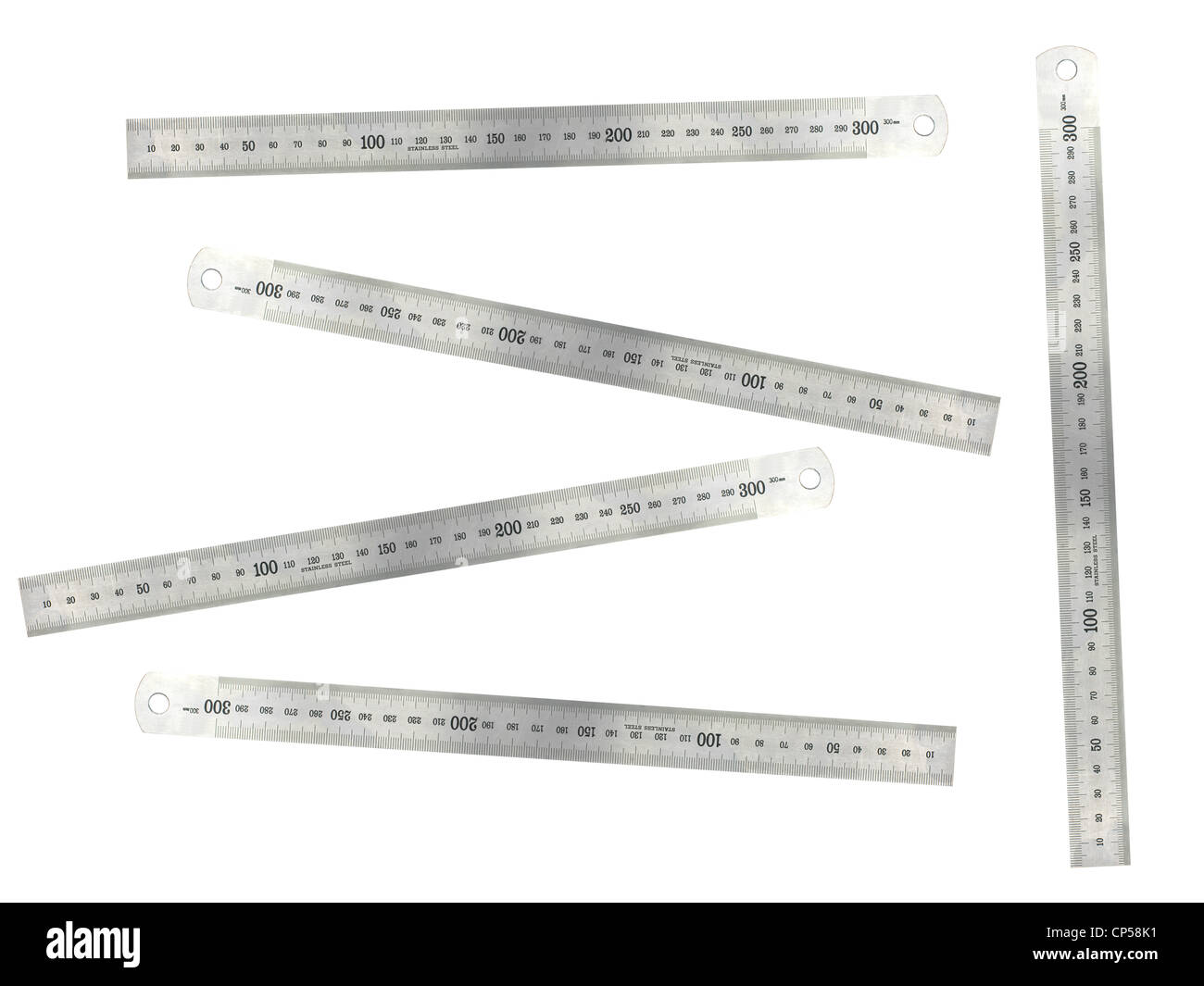 A metal ruler isolated against a white background Stock Photo - Alamy