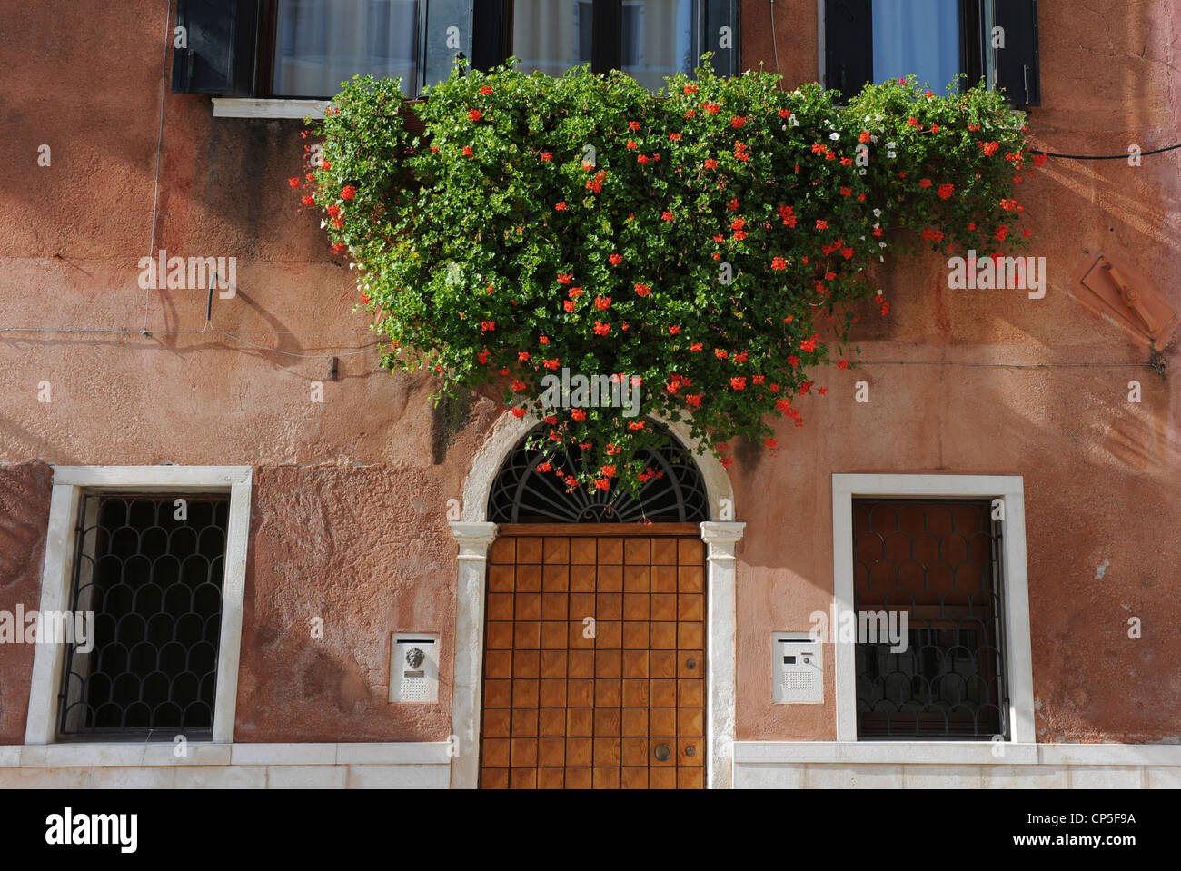Flowers on building Venice, Italy Stock Photo - Alamy