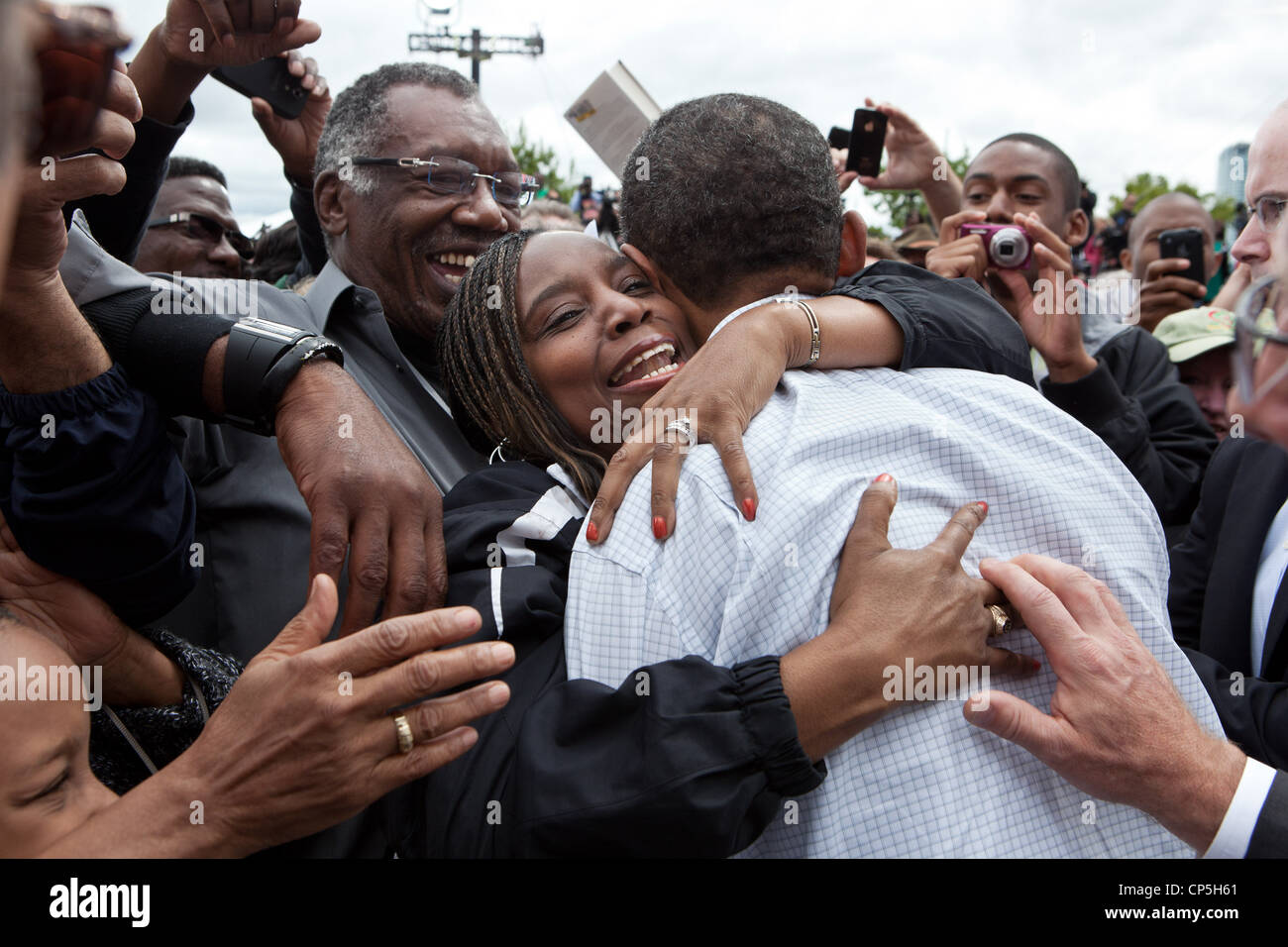 President Barack Obama hugs a woman in the crowd after addressing the ...