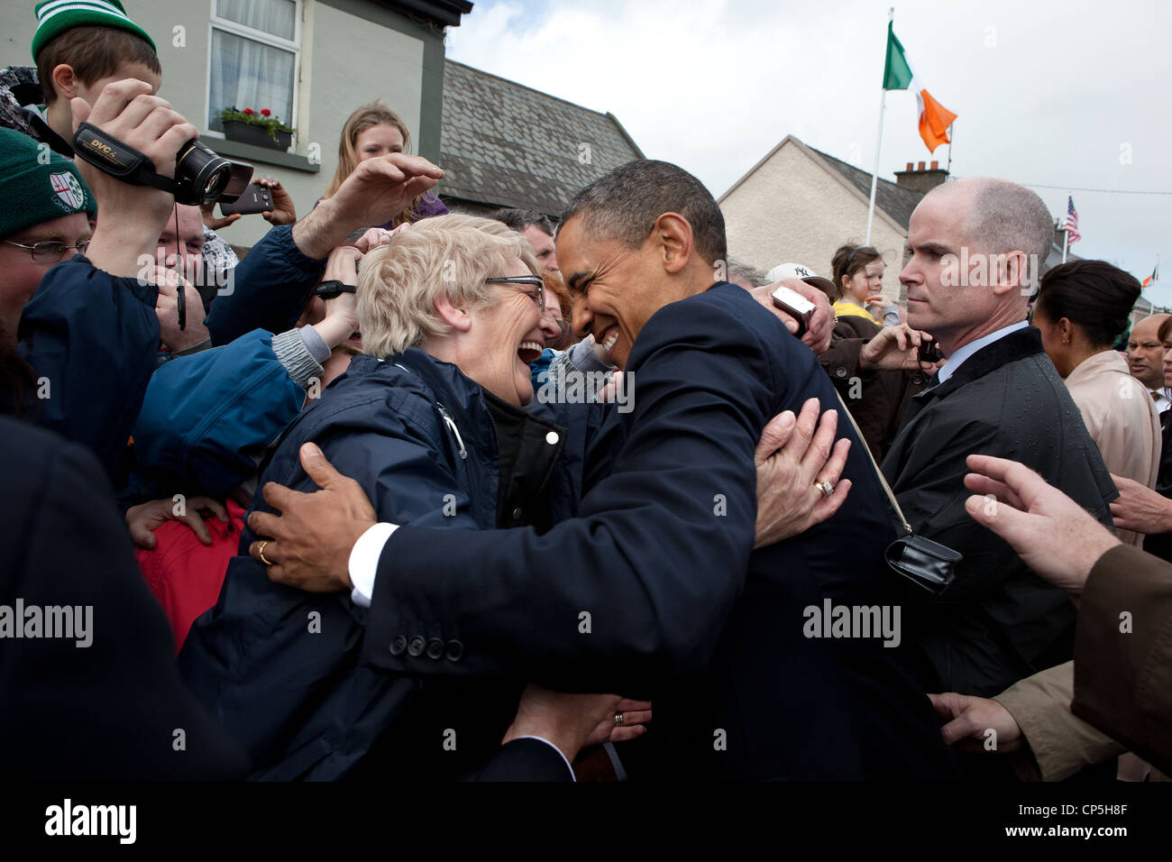 President Barack Obama greets a local resident on Main Street in ...