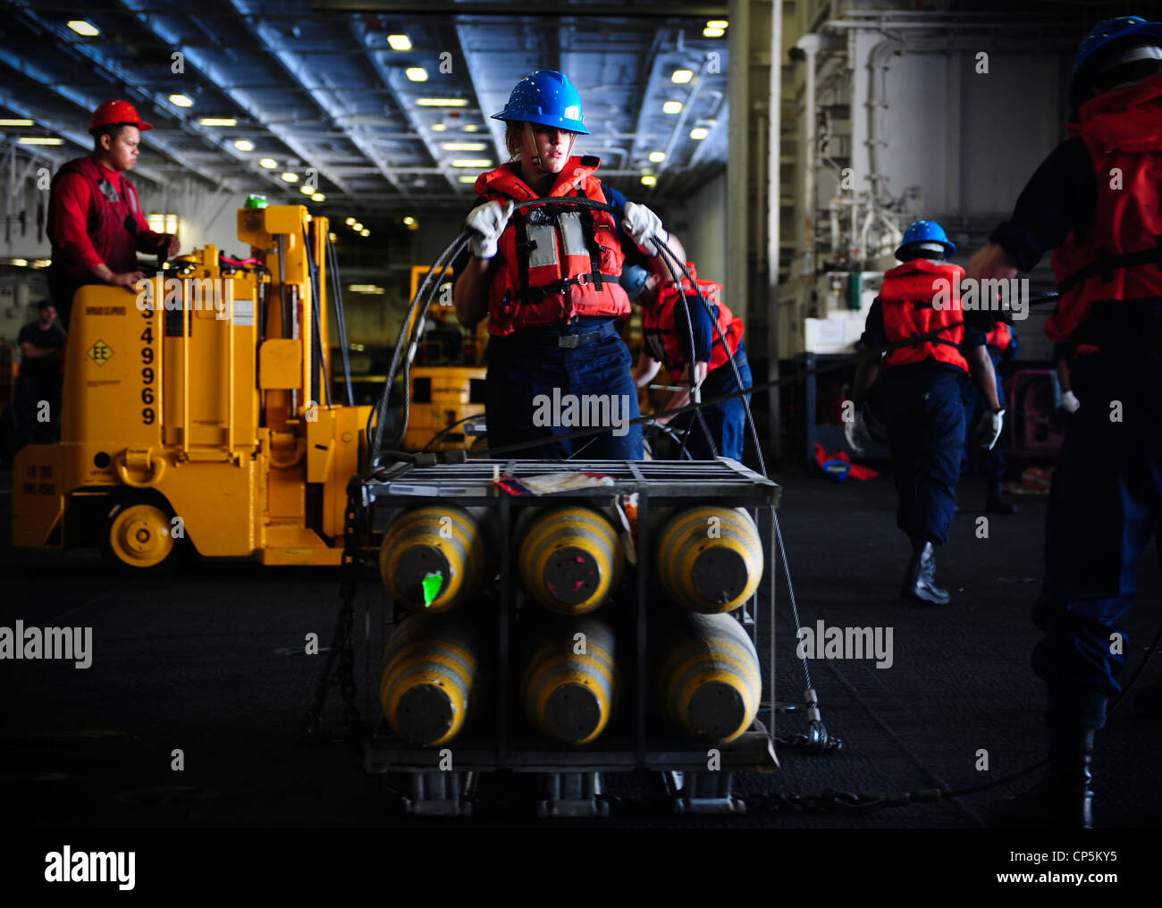 Seaman Jessica E. Morris prepares to rig an ordnance pallet in the ...