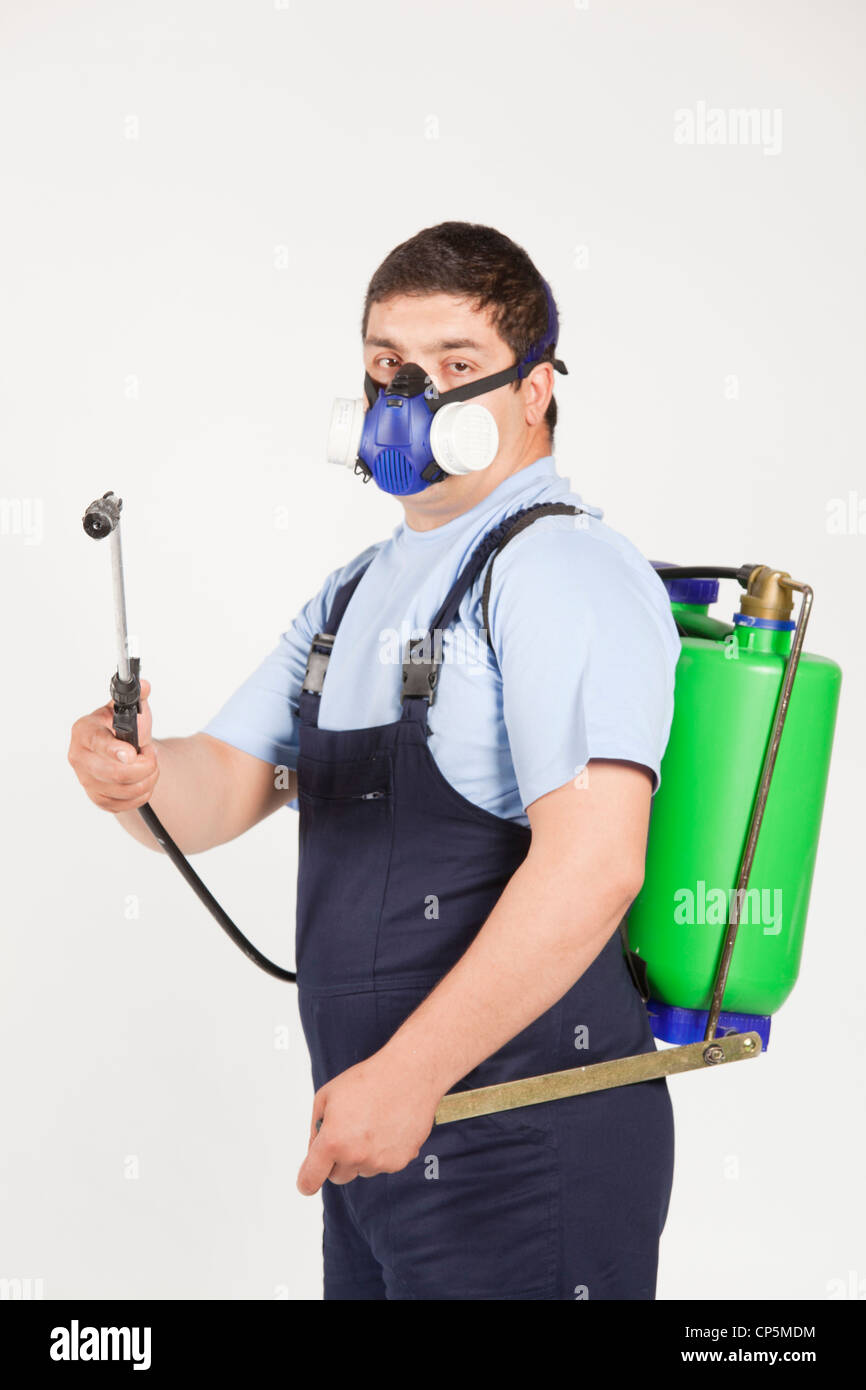 Man spraying insects- pest control Stock Photo - Alamy