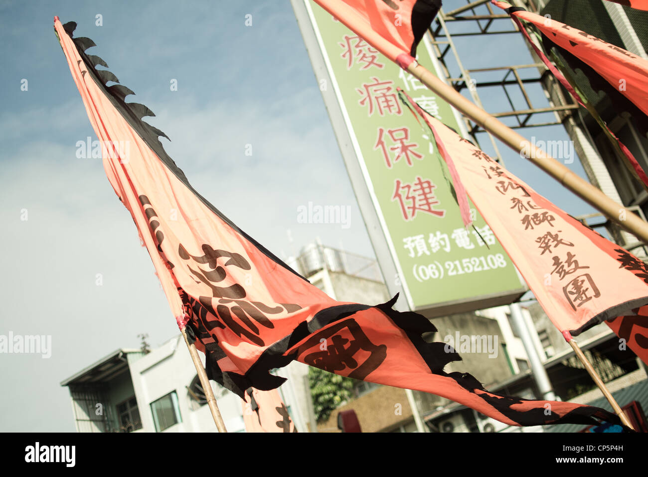 Old triangular shaped flags of temple groups Stock Photo - Alamy