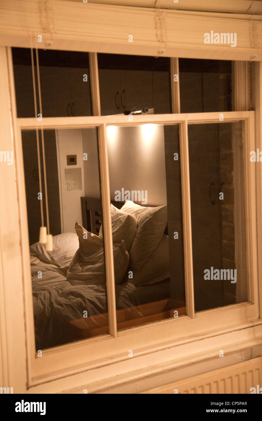 Bedroom Reflected in Window Stock Photo - Alamy